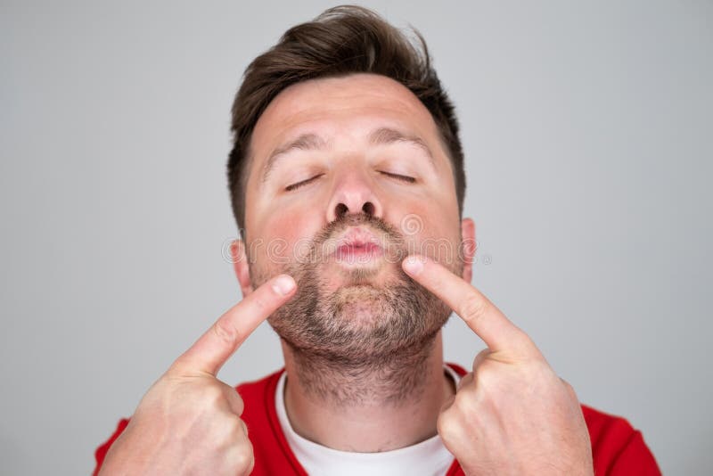 Middle Age Man Pointing on His Lips Asking for a Kiss. Stock Photo ...