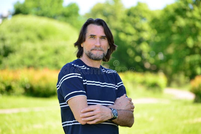 Middle Age Man Standing Outdoors Stock Photo - Image of relaxed, green ...