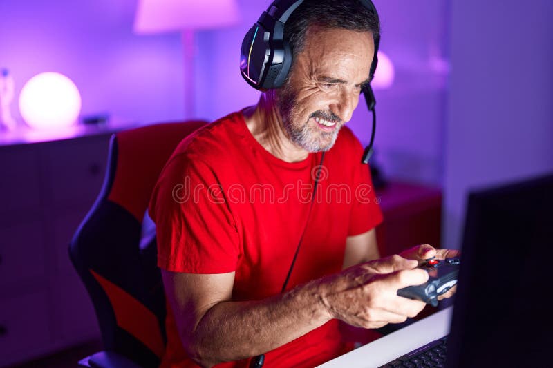 Middle Age Man Streamer Playing Video Game Using Joystick at Gaming ...