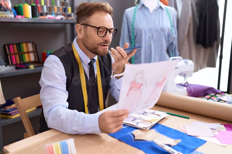 Middle Age Man Tailor Talking on Smartphone Looking Clothing Design at ...
