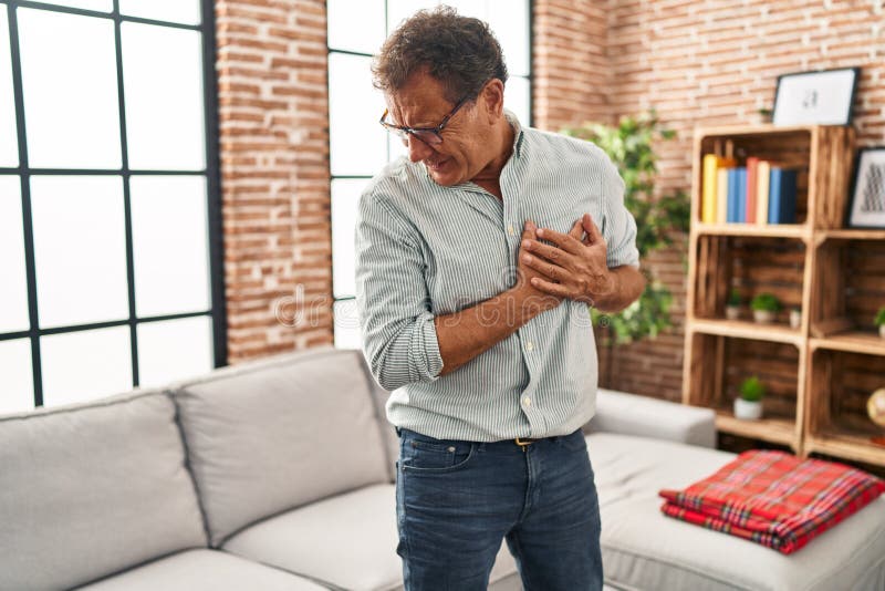 Middle Age Man Touching Chest Suffering Heart Attack at Home Stock ...