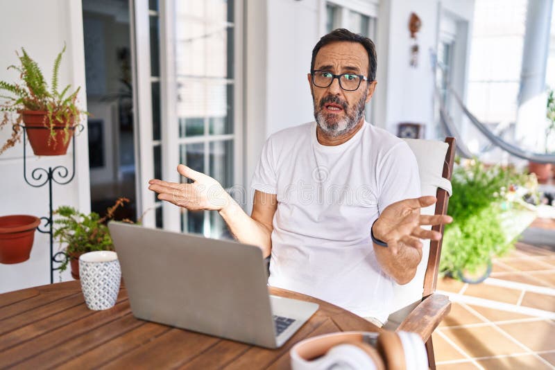 Middle Age Man Using Computer Laptop at Home Clueless and Confused with ...