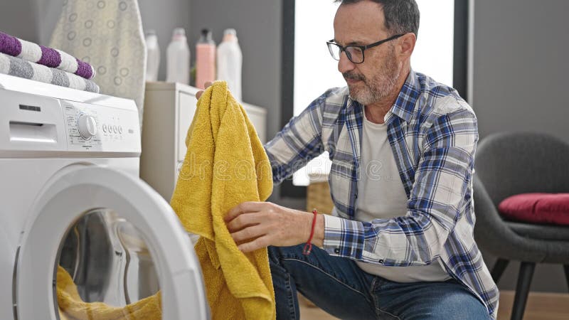 Middle Age Man Washing Clothes at Laundry Room Stock Photo - Image of ...
