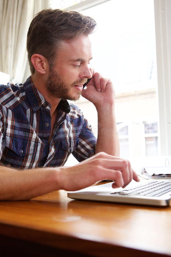 Middle Age Man Working with Laptop and Smart Phone Stock Image - Image ...