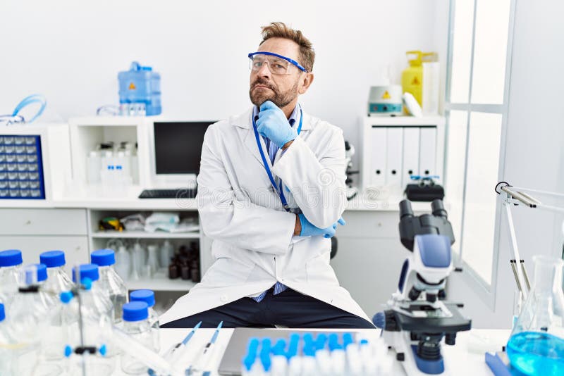Middle Age Man Working at Scientist Laboratory Serious Face Thinking ...