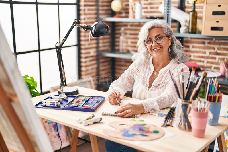 Middle Age Woman Artist Drawing on Notebook at Art Studio Stock Image ...