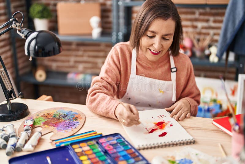 Middle Age Woman Artist Drawing on Notebook at Art Studio Stock Image ...