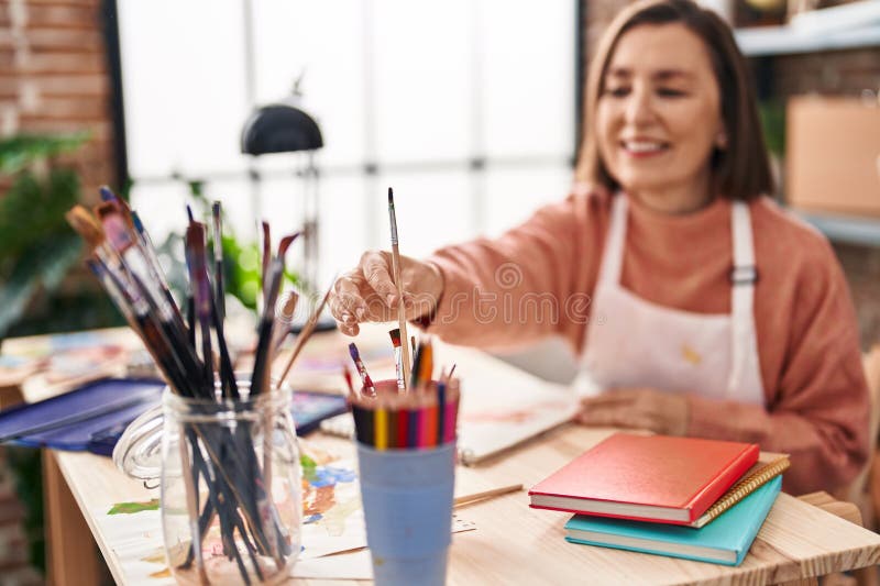 Middle Age Woman Artist Drawing on Notebook at Art Studio Stock Photo ...
