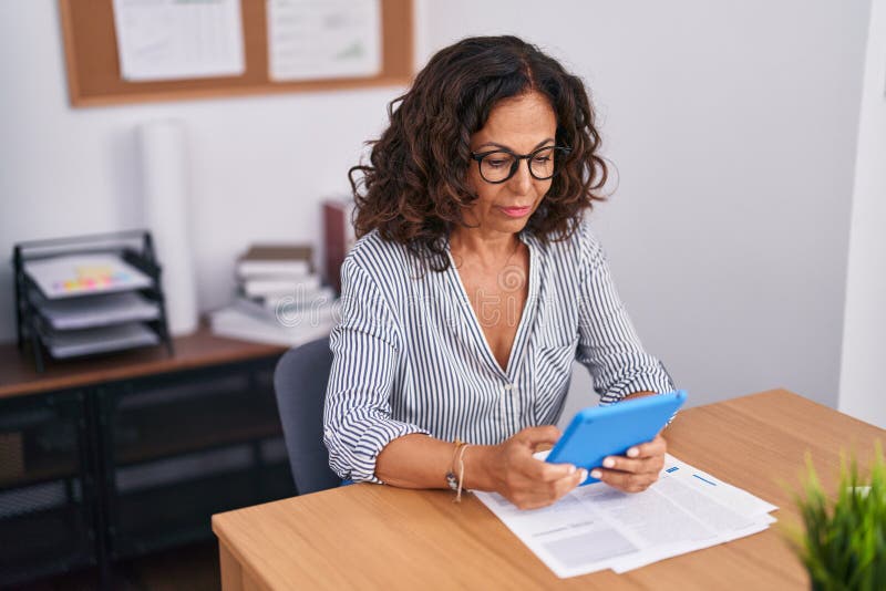 Middle Age Woman Business Worker Using Touchpad Working at Office Stock ...