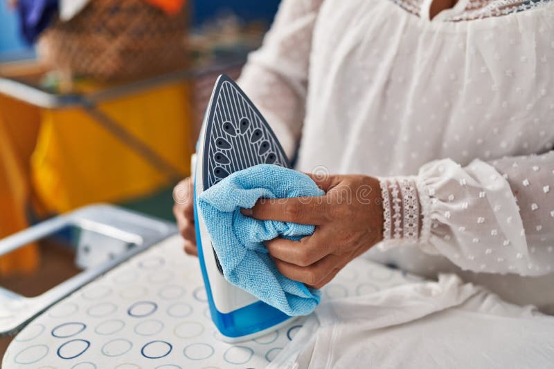 Middle Age Woman Cleaning Iron at Laundry Room Stock Photo - Image of ...