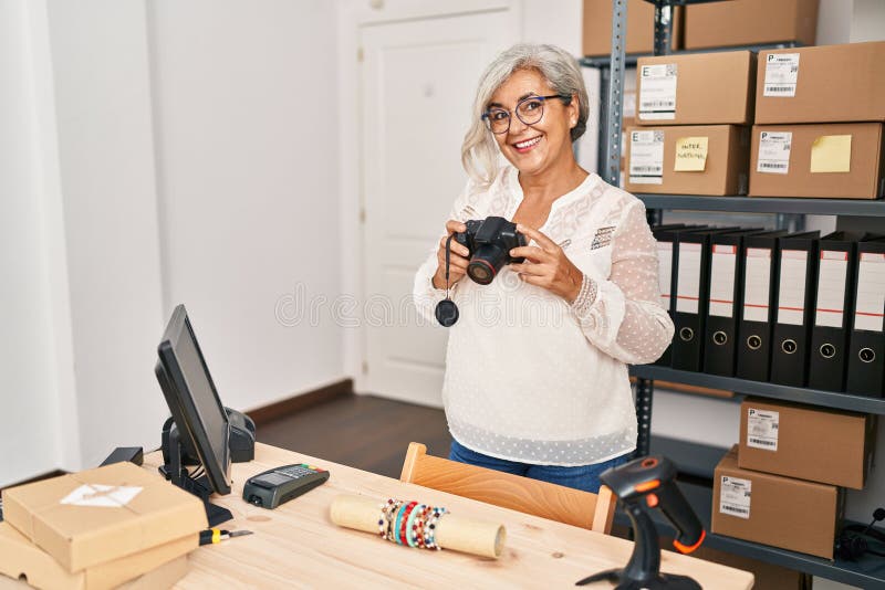 Middle Age Woman Ecommerce Business Worker Using Professional Camera at ...