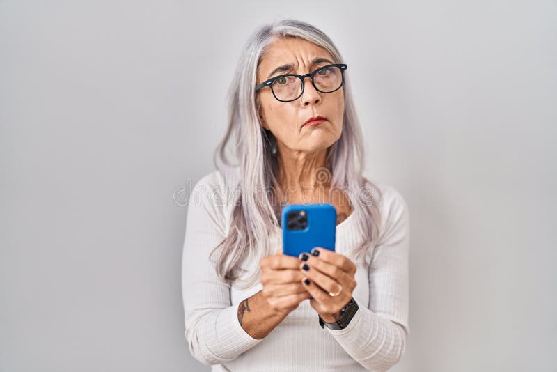 Middle Age Woman with Grey Hair Using Smartphone Typing Message ...