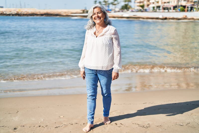 Middle Age Woman Smiling Confident Standing at Seaside Stock Image ...