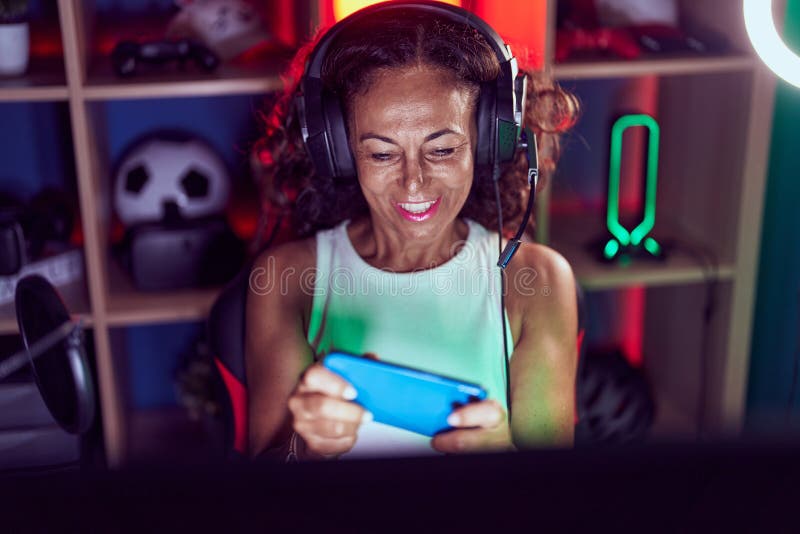 Middle Age Woman Streamer Playing Video Game Using Smartphone at Gaming ...