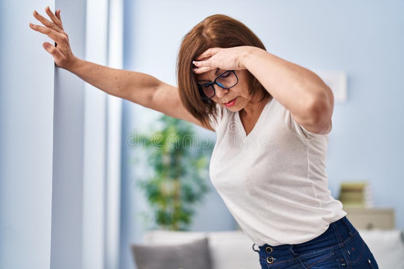 Middle Age Woman Suffering Dizzy Standing at Home Stock Image - Image ...