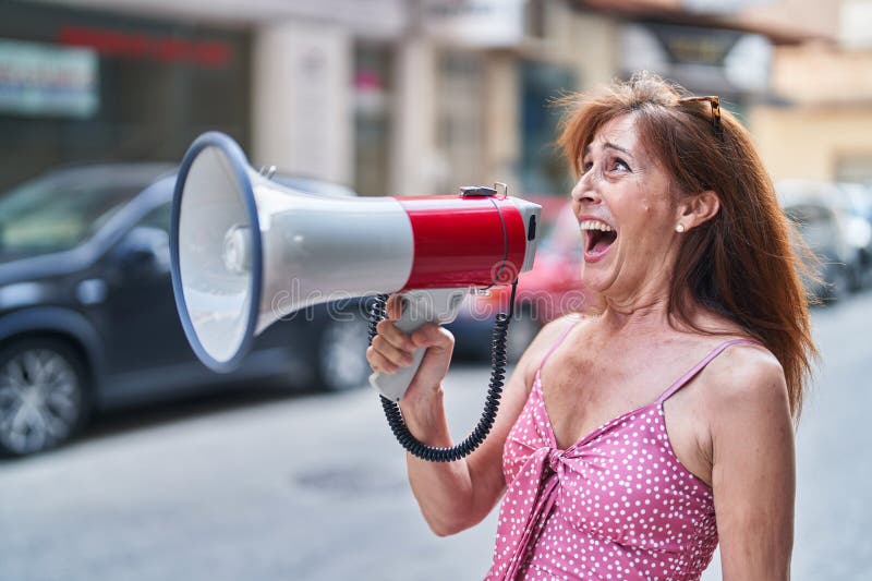 Middle Age Woman Using Megaphone Screaming at Street Stock Photo ...