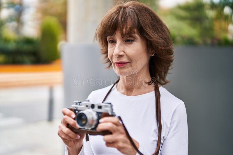 Middle Age Woman Using Vintage Camera at Street Stock Photo - Image of ...