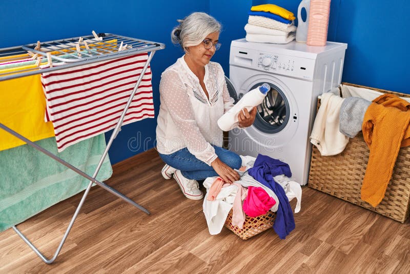 Middle Age Woman Washing Clothes at Laundry Room Stock Photo - Image of ...