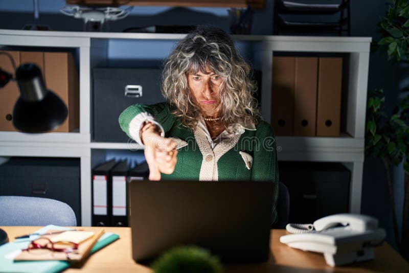 Middle Age Woman Working at Night Using Computer Laptop Looking Unhappy ...