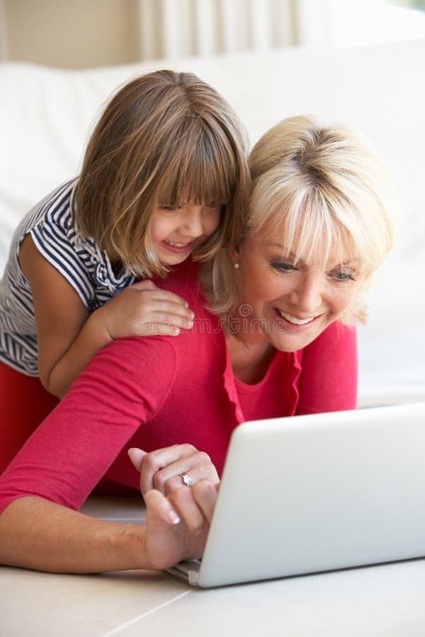 Middle Age Woman with Young Girl Using Laptop Stock Image - Image of ...