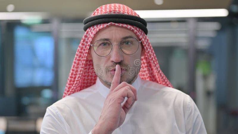 Middle Aged Arab Man Putting Finger on Lips Stock Photo - Image of data ...