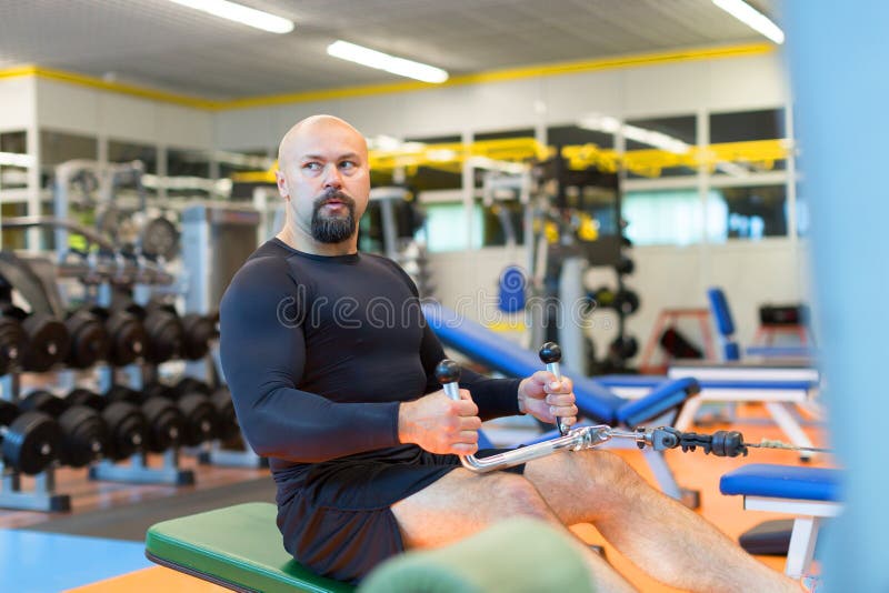 Middle Aged Athlete Doing Workouts on a Back with Power Exercise ...