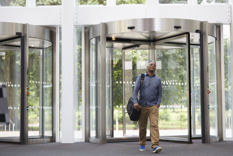 Middle Aged Black Man Entering the Foyer of Modern Building Stock Photo ...