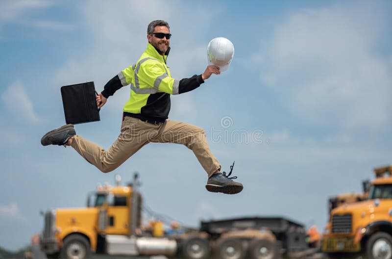 Middle Aged Builder Excited Jump on Site Construction. Excited Builder ...