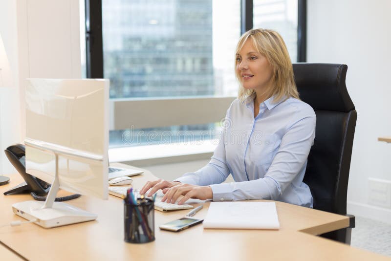 Middle Aged Business Woman Working at Office Stock Image - Image of ...