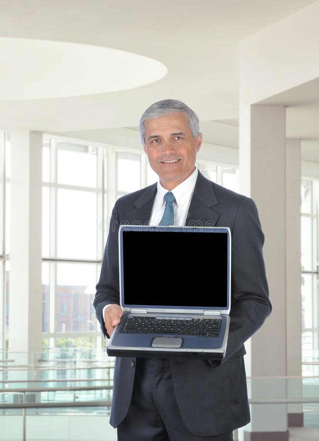 Middle Aged Businessman with Laptop Computer Stock Photo - Image of ...
