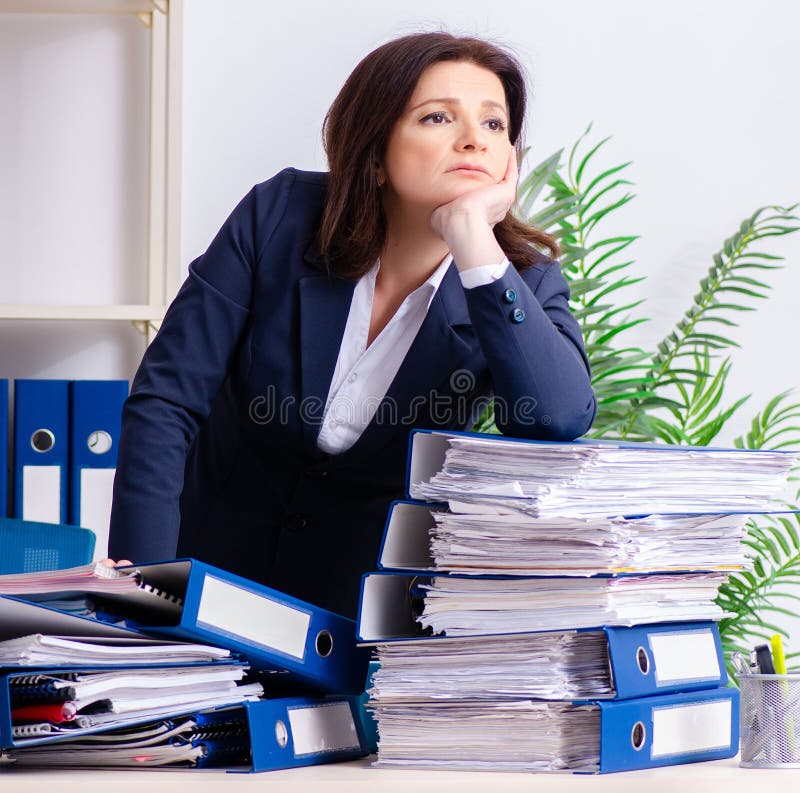 Middle-aged Businesswoman Unhappy with Excessive Work Stock Image ...