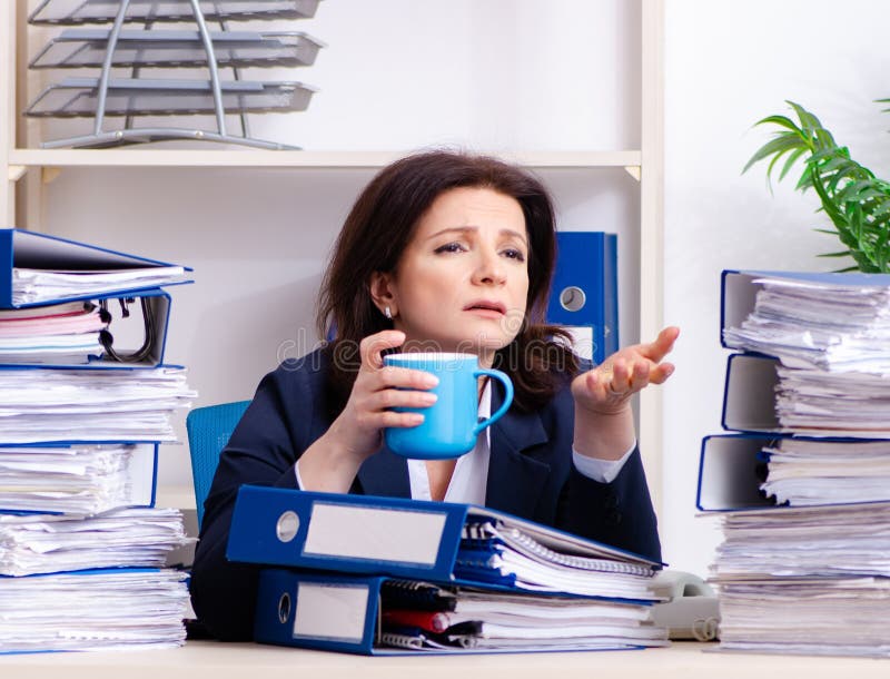 Middle-aged Businesswoman Unhappy with Excessive Work Stock Photo ...