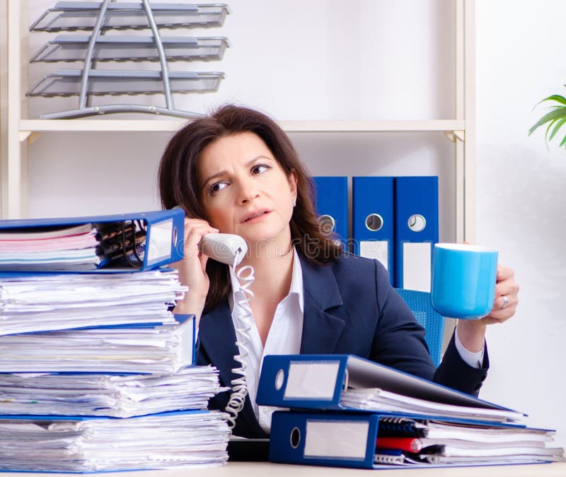 Middle-aged Businesswoman Unhappy with Excessive Work Stock Photo ...