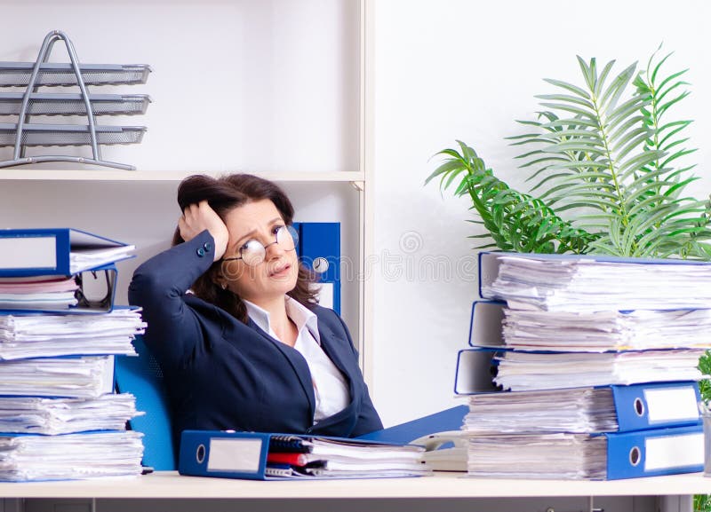 Middle-aged Businesswoman Unhappy with Excessive Work Stock Photo ...
