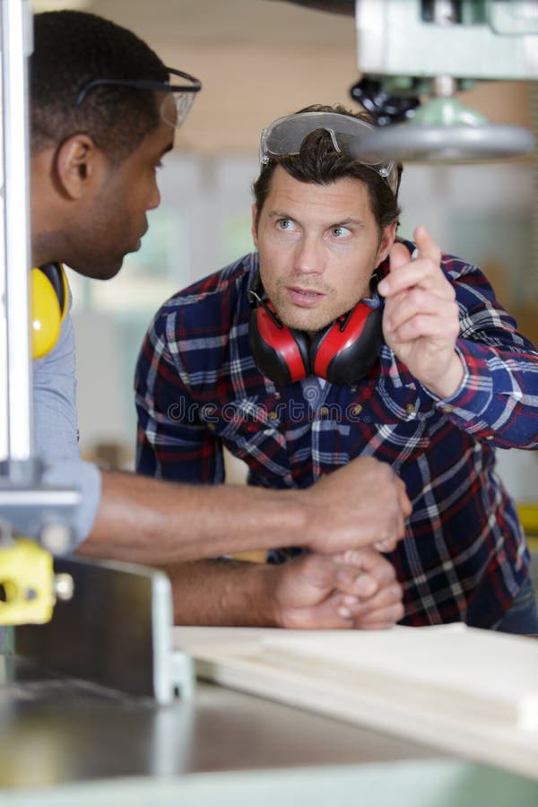 Middle-aged Carpenter and Apprentice Make Together Product Stock Photo ...