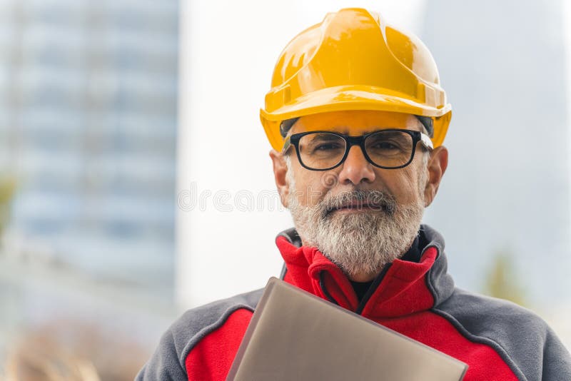 Middle-aged Construction Site Manager Wearing Glasses and Hard Hat ...