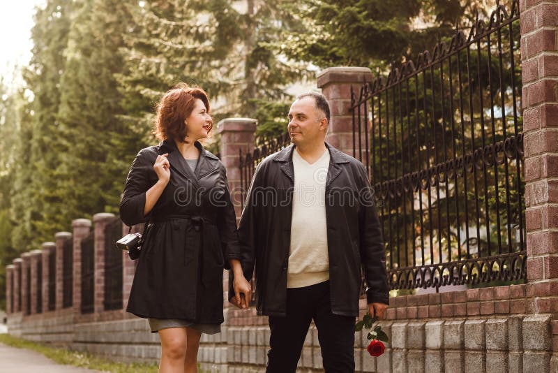 Middle-aged couple on walk stock image. Image of fall - 123611183