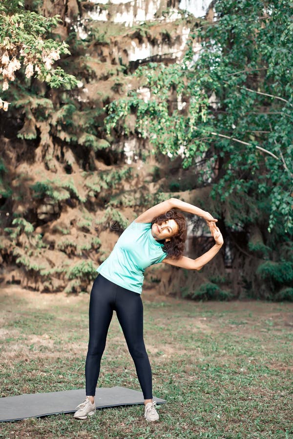 Middle Aged Elderly Active Woman Doing Exercise in a Park Outdoor Stock ...