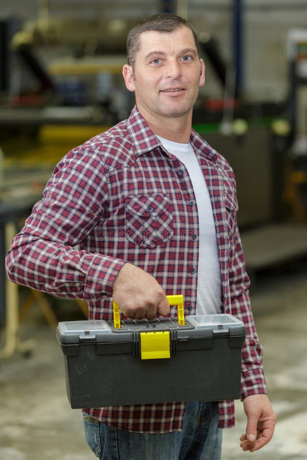 Middle-aged Engineer Carrying Toolbox in Factory Stock Photo - Image of ...