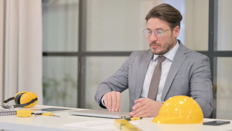 Middle Aged Engineer Coming Back Opening Laptop in Office Stock Image ...