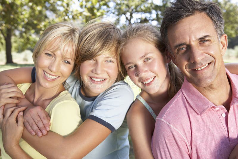 Middle Aged Family in Field in Countryside Stock Photo - Image of ...