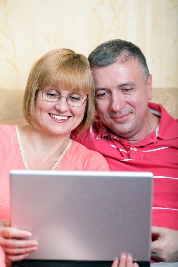 Middle-aged Family Surfing Internet Stock Image - Image of male, loving ...