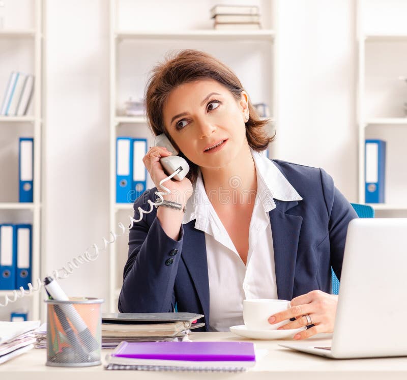Middle-aged Female Employee Sitting at the Office Stock Image - Image ...