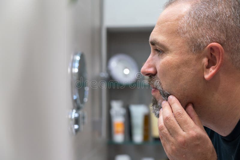 Middle-aged Handsome Man Using Razor in Bathroom Stock Image - Image of ...