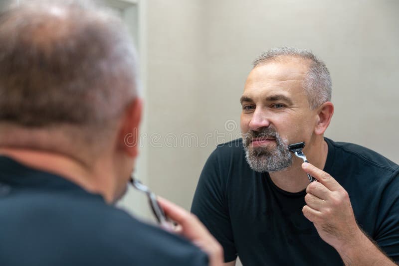 Middle-aged Handsome Man Using Razor in Bathroom Stock Image - Image of ...
