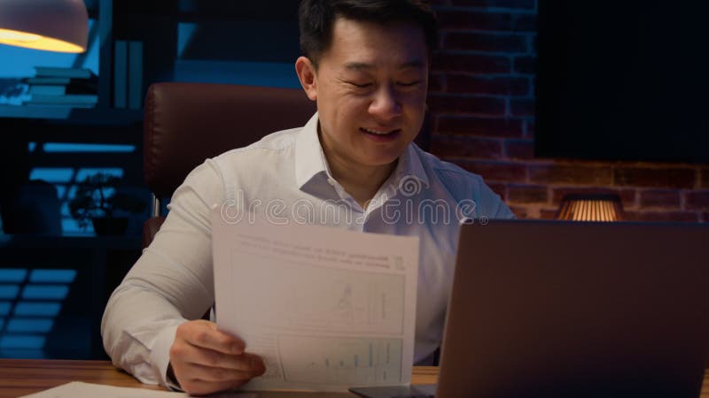 Middle Aged Happy Smiling Businessman Working With Laptop And Documents