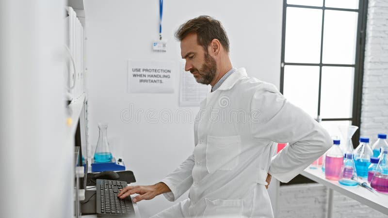 Middle-aged Hispanic Man with Beard Wearing Lab Coat Suffers Back Pain ...