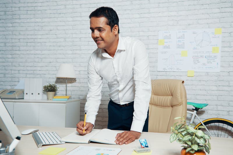 Businessman Writing Information Down Stock Image - Image of middleaged ...