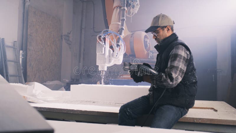 Man Controlling Robotic Milling Machine in Workshop Stock Photo - Image ...