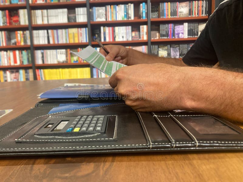 Middle Aged Man Calculating and Checking Papers Stock Image - Image of ...